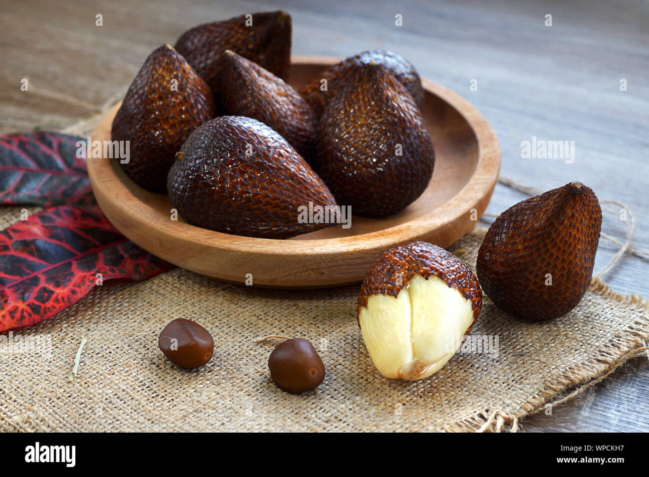 salak fruit or snake fruit native to java island on wooden plate Stock ...