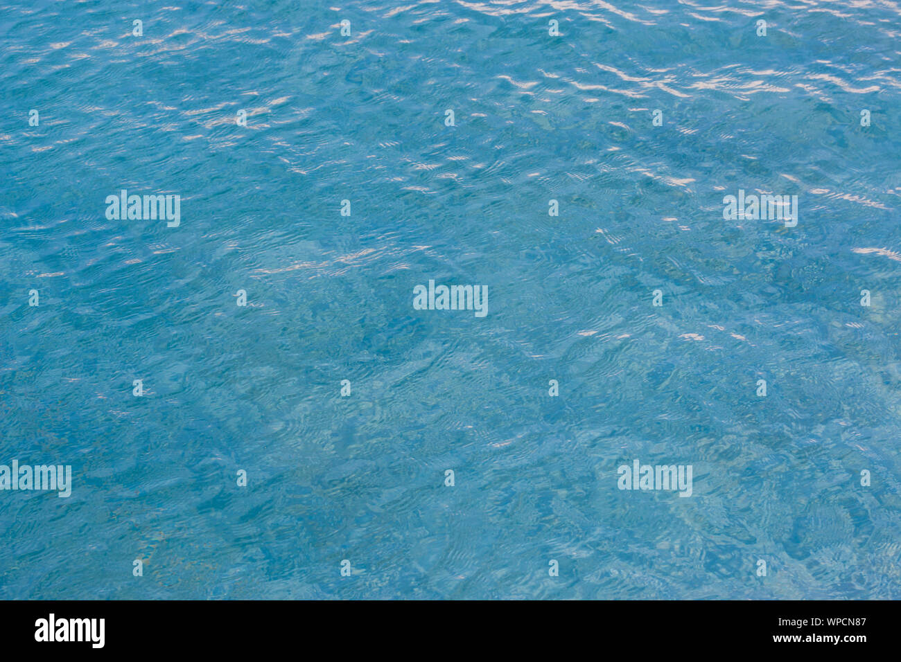 Blue swimming pool water surface texture background Stock Photo - Alamy
