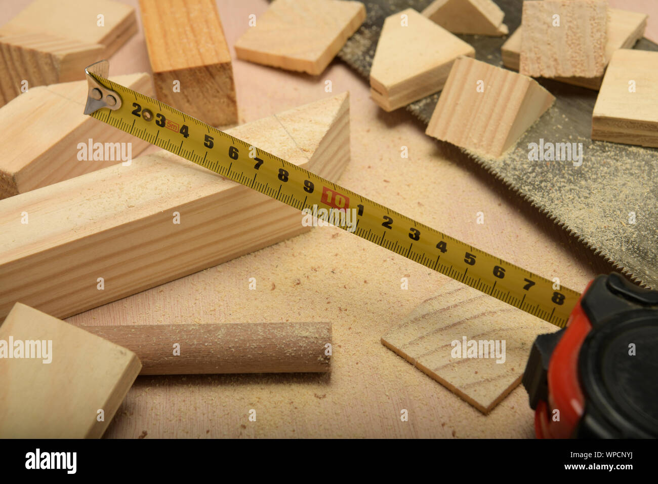 Close up, detail, carpentry, tape measure with wood blocks cut into ...