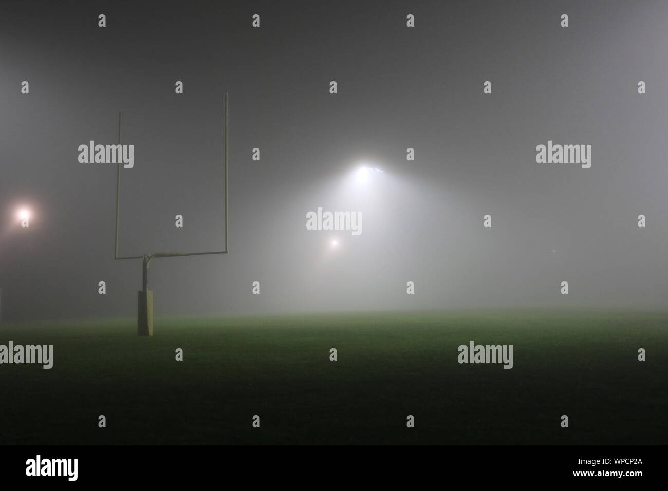 Goal posts stand alone on a foggy sports ground, northern California ...