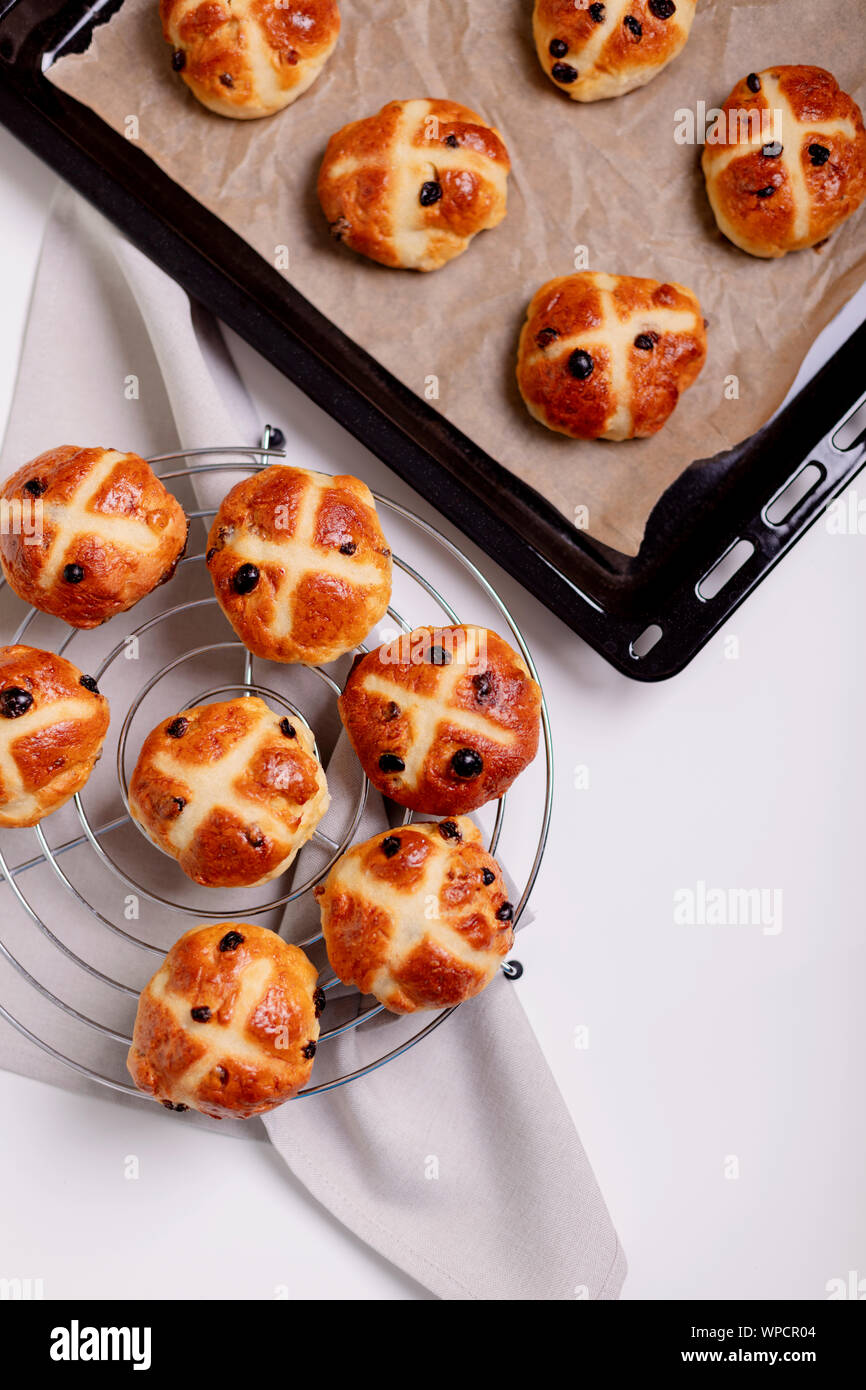 Buns marked with a cross and containing dried fruit, traditionally ...