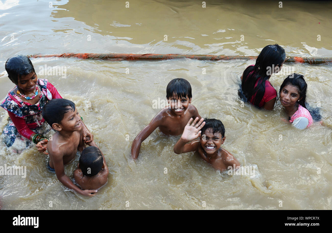 Indian children enjoying themselves in the Ganges river in Varanasi ...