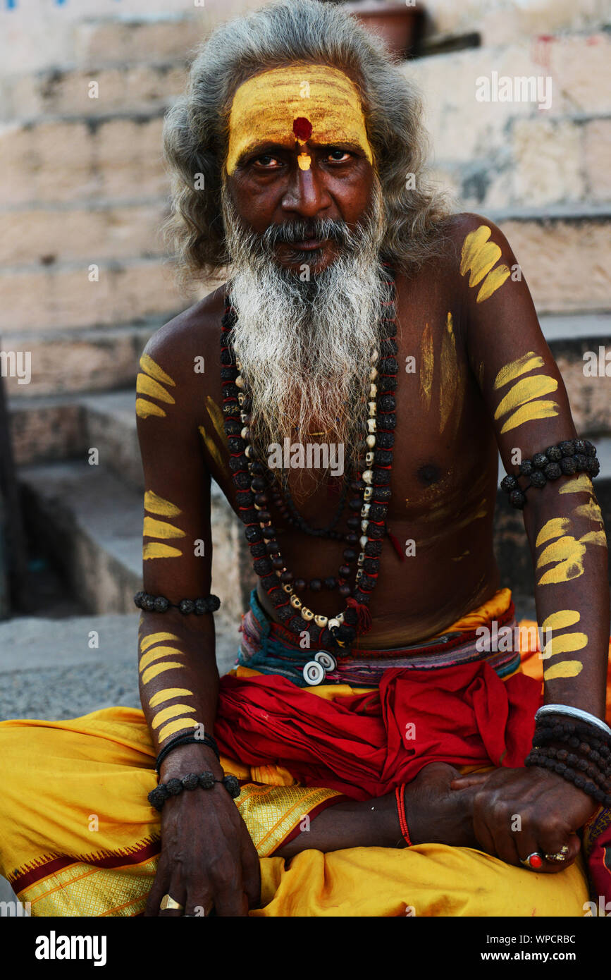 A Sadhu sitting by the Ganges river in Varanasi Stock Photo - Alamy