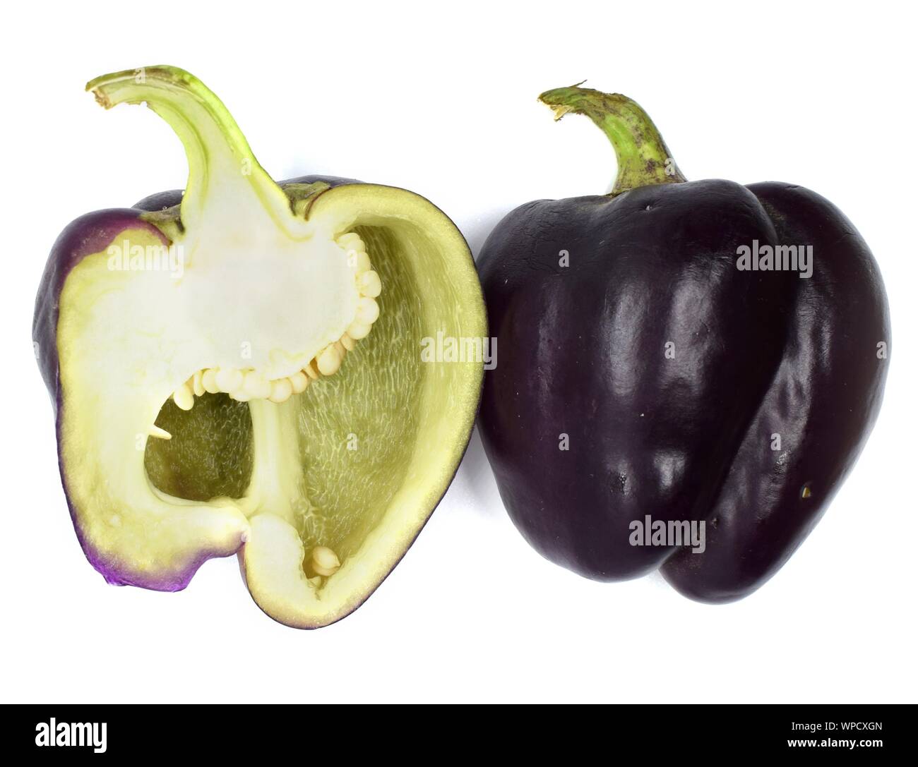 Halved purple bell pepper isolated on a white background Stock Photo ...