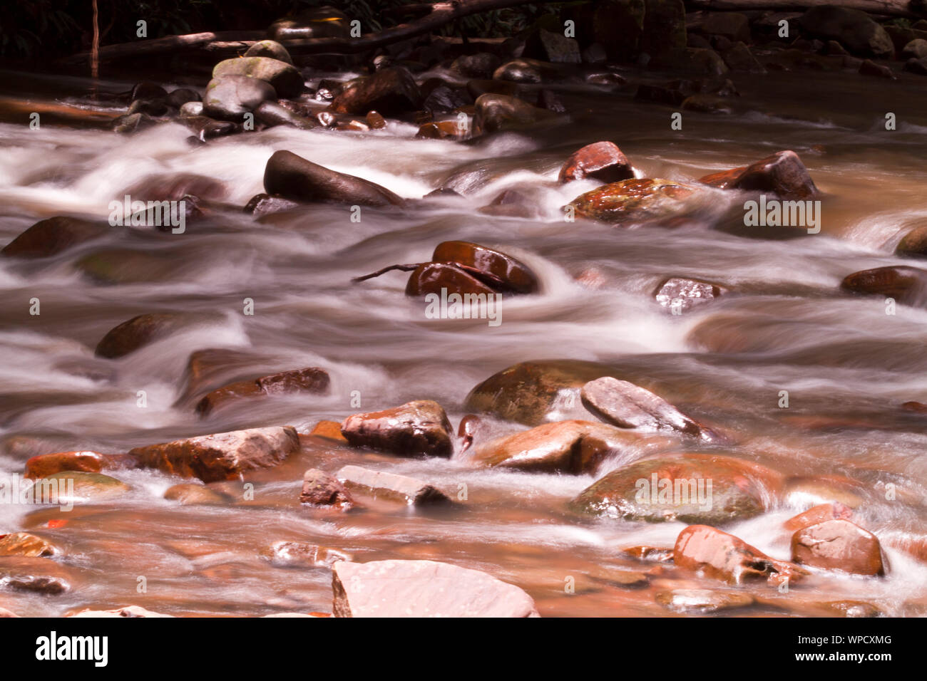 river stream flowing in slow shutter mode Stock Photo - Alamy