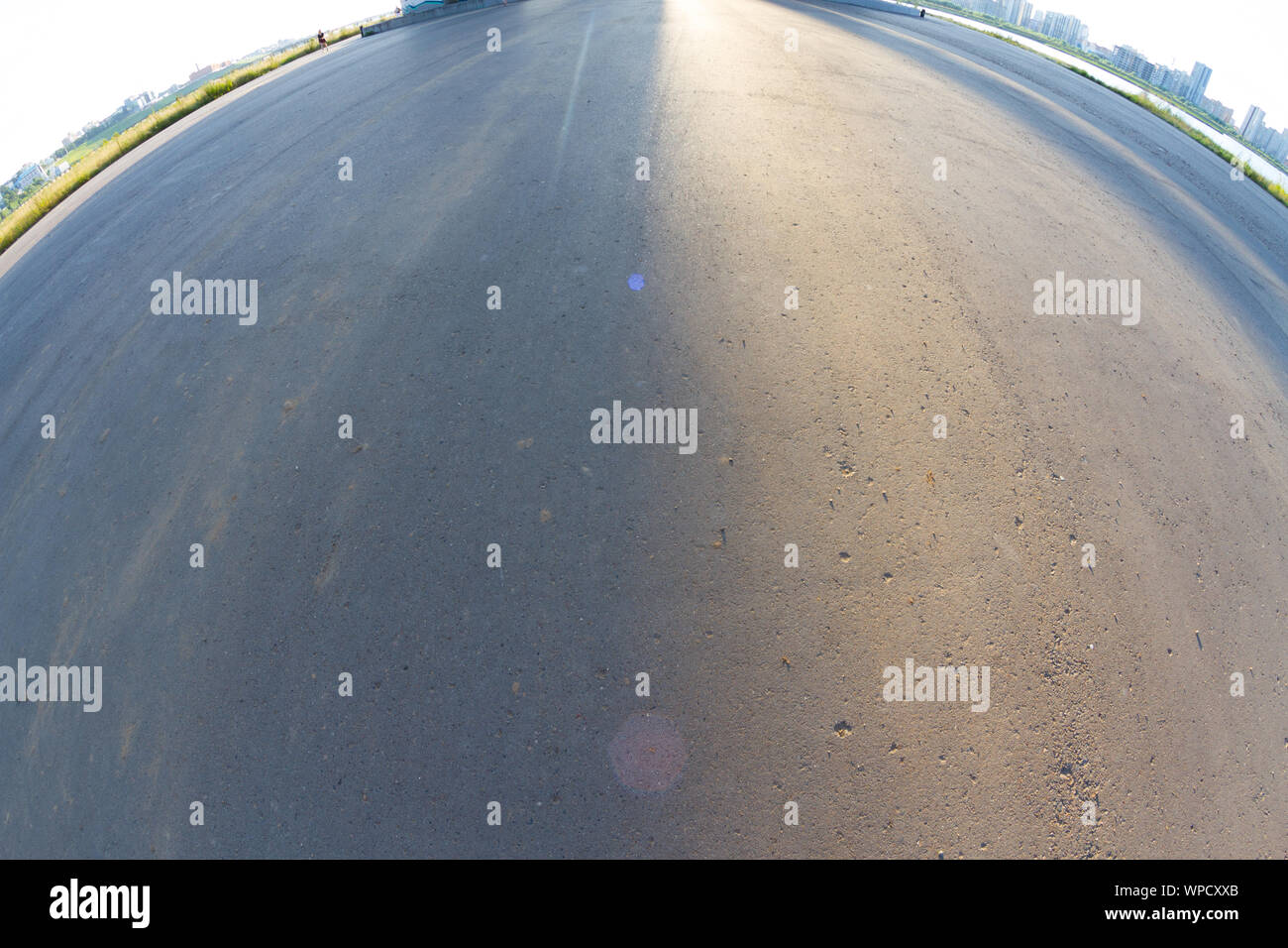 Asphalt road goes somewhere. Fish eye lens Stock Photo - Alamy