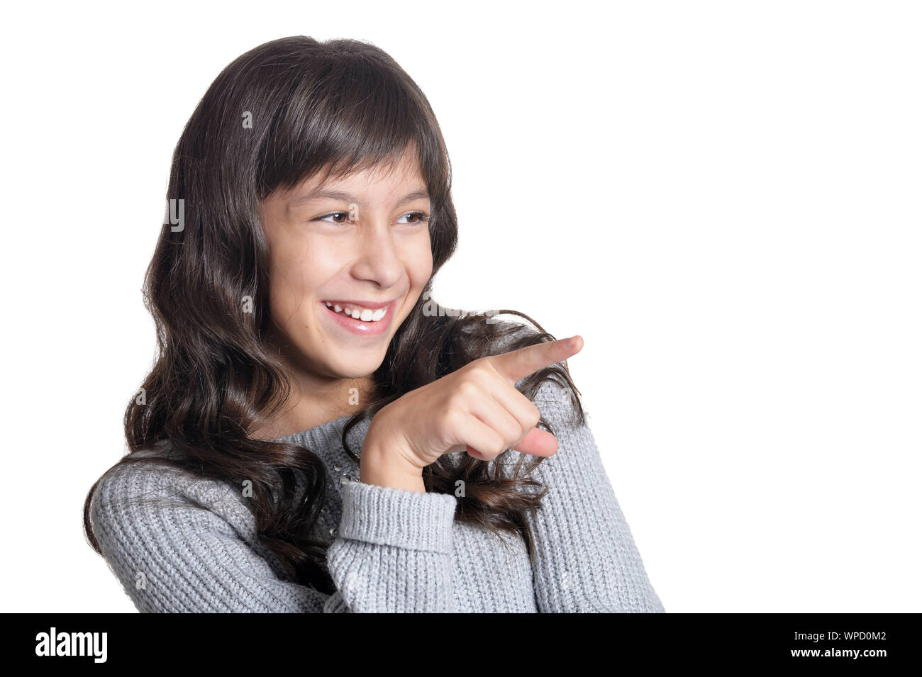 Portrait of cute girl pointing and posing isolated Stock Photo - Alamy
