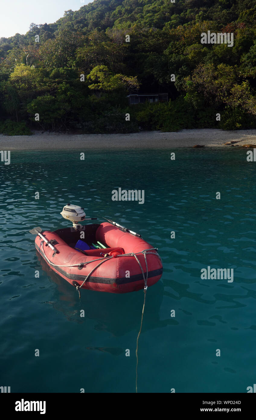 Little red inflatable boat near beach, Fitzroy Island, Great Barrier ...