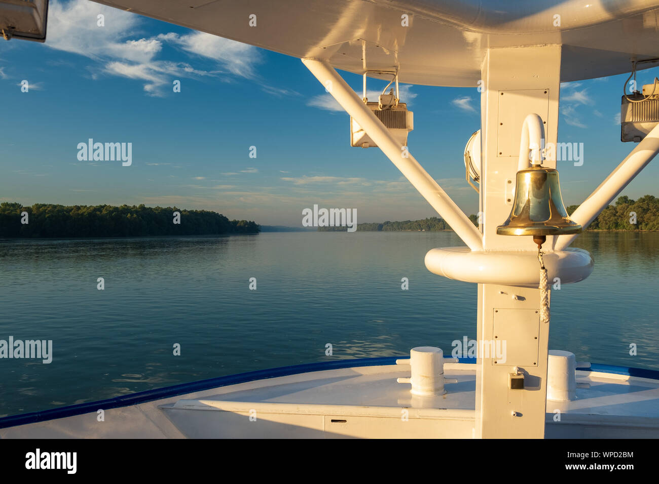 Bell on sailing ship at sunrise Stock Photo - Alamy