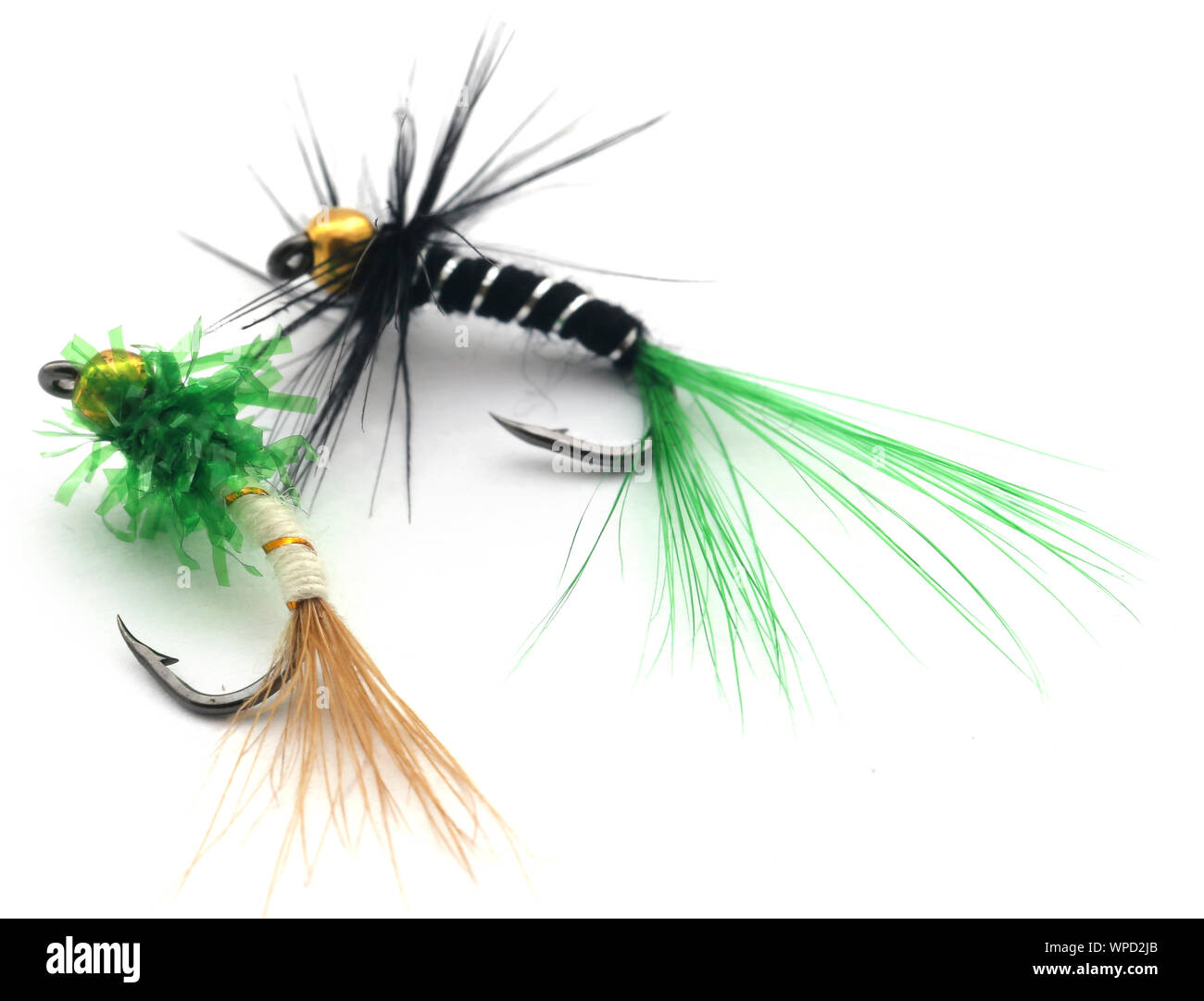 Fishing flies of diffrent colors with hooks over white background Stock ...