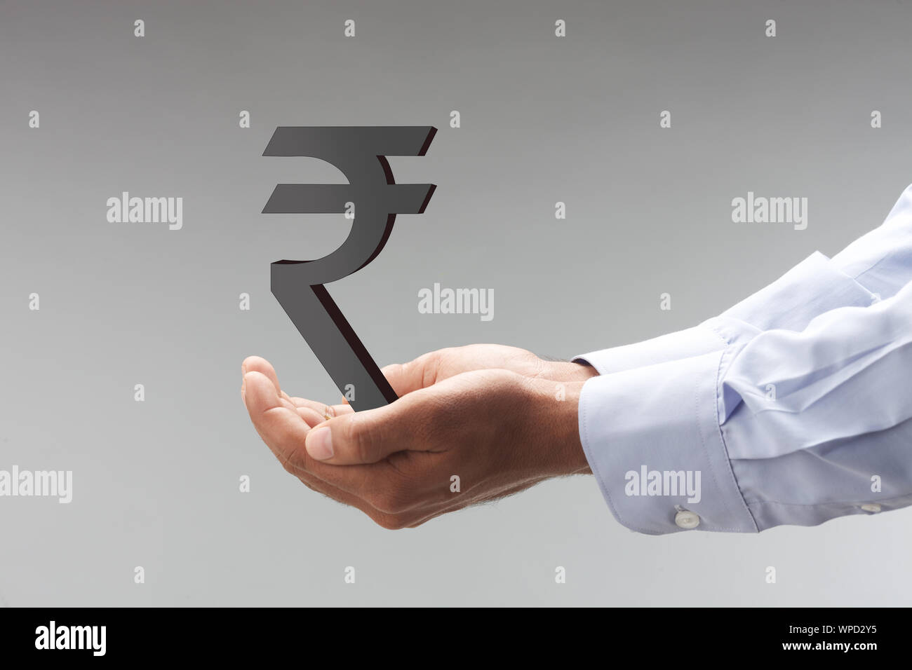 Person's hand showing Indian rupee symbol Stock Photo - Alamy