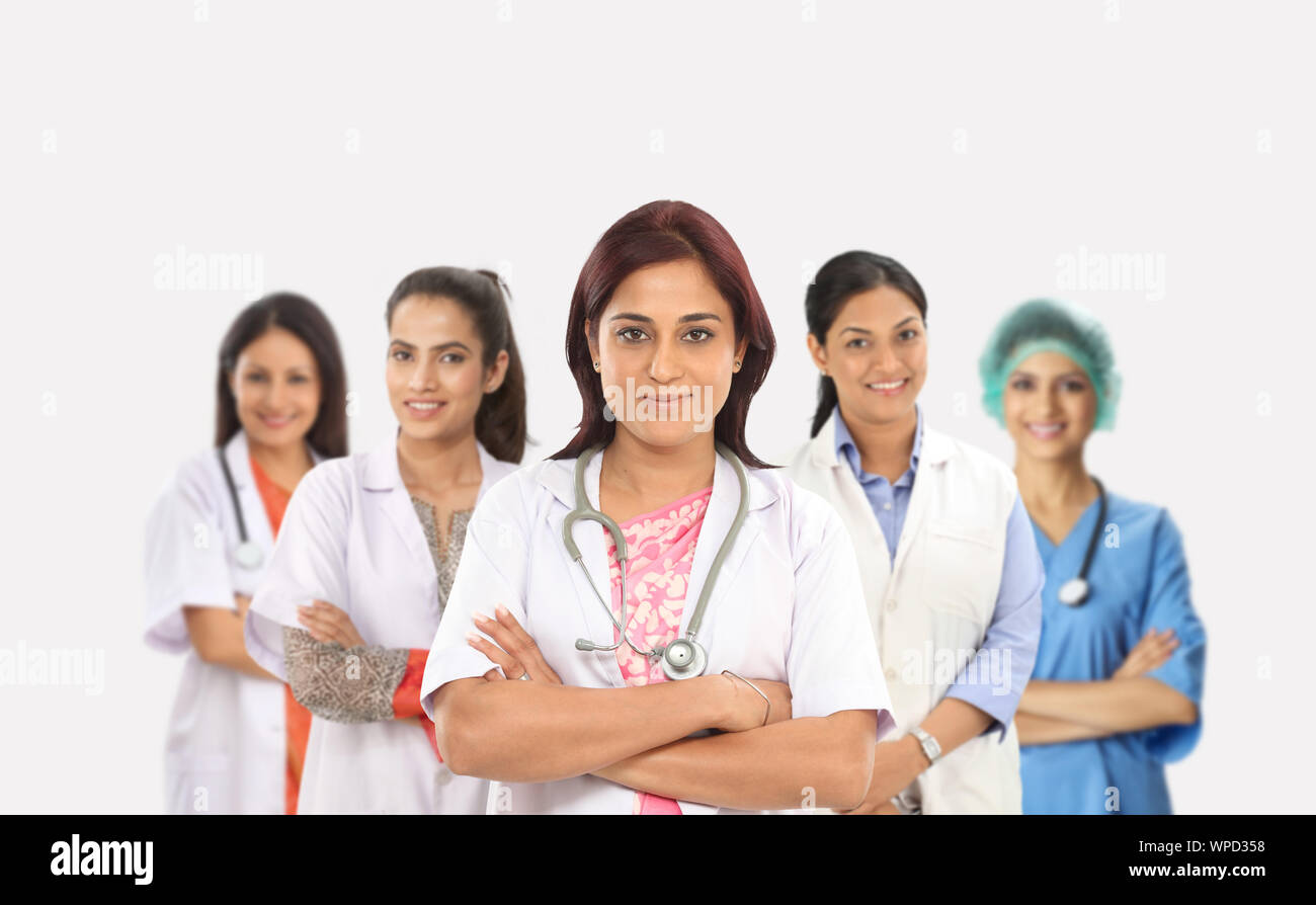 Portrait of confident group of doctors standing together Stock Photo ...