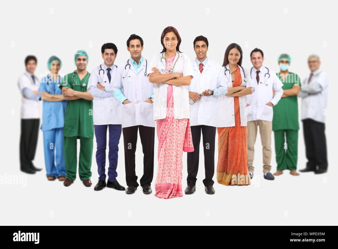 Confident team of medical professionals lead by female doctor Stock ...