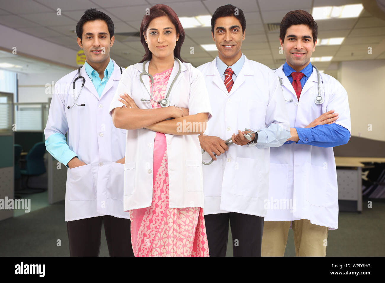 Confident group of doctors standing together in a hospital Stock Photo ...
