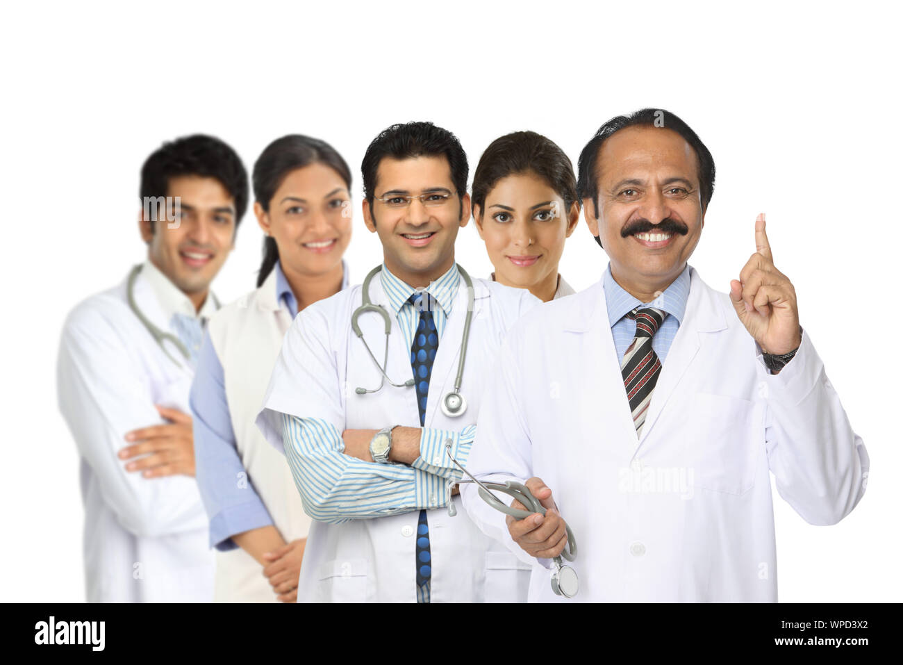 Portrait of confident group of doctors standing together Stock Photo ...