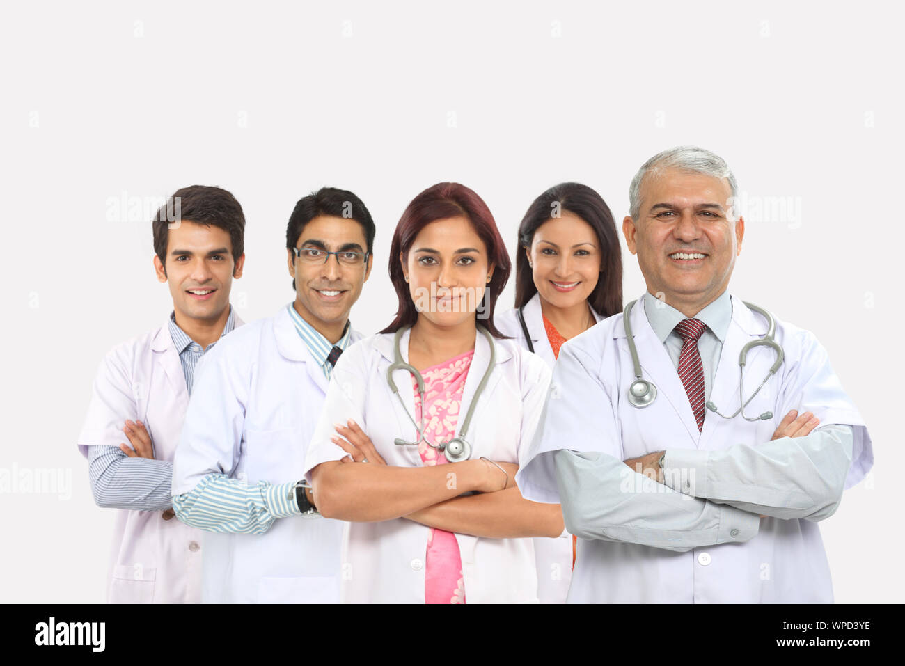 Portrait of confident group of doctors standing together Stock Photo ...