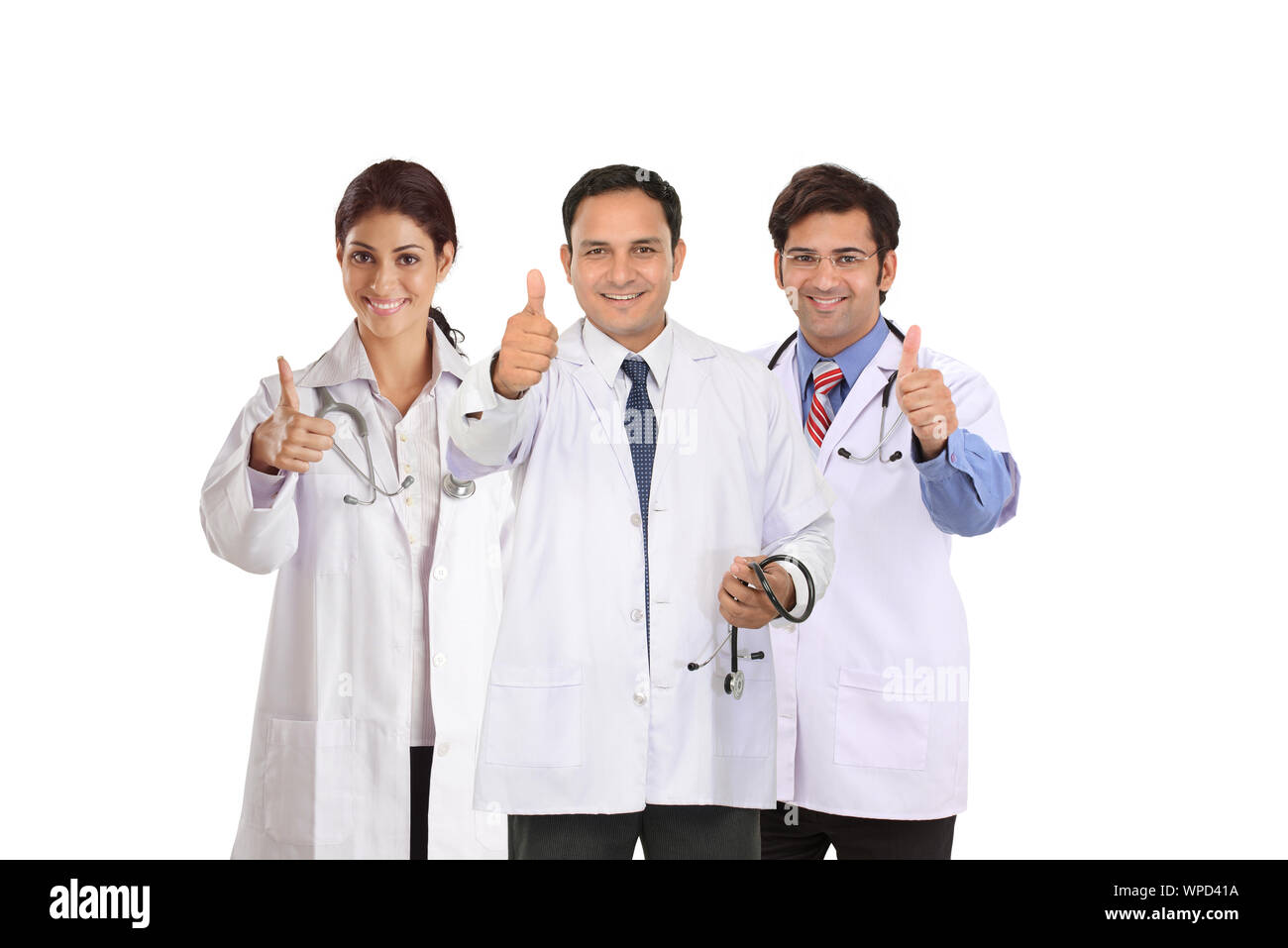 Confident group of doctors showing thumbs up sign Stock Photo - Alamy
