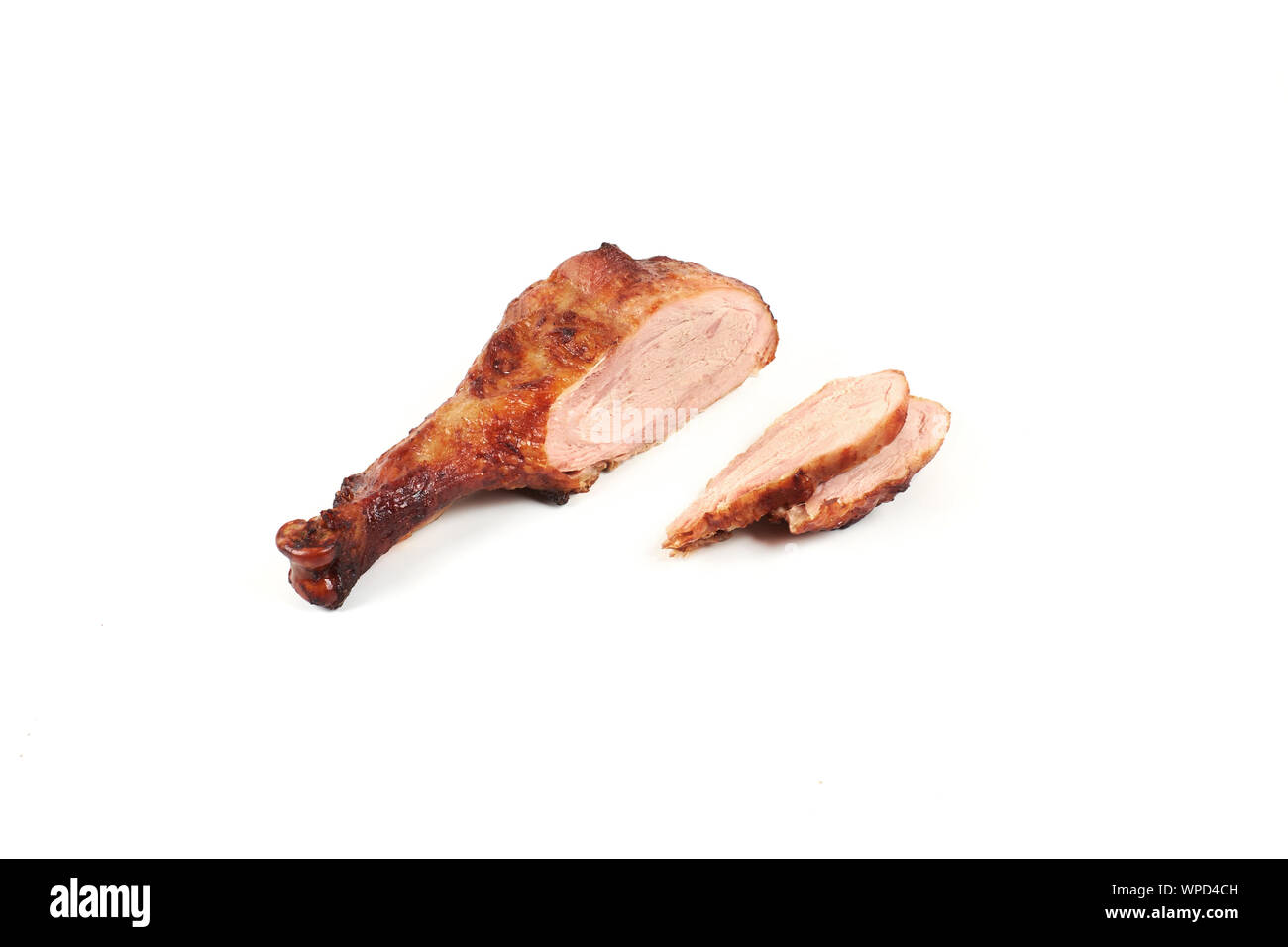 roast turkey leg and sliced turkey meat isolated on white background ...