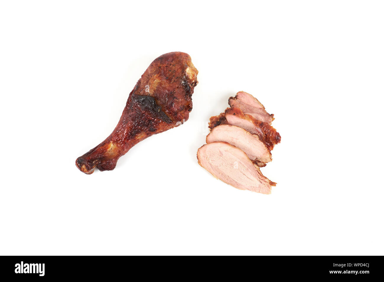 roast turkey leg and sliced turkey meat isolated on white background ...