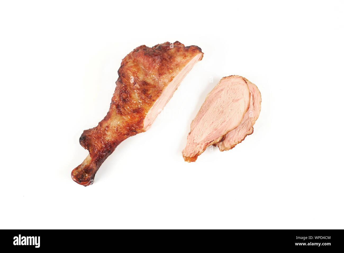 roast turkey leg and sliced turkey meat isolated on white background ...