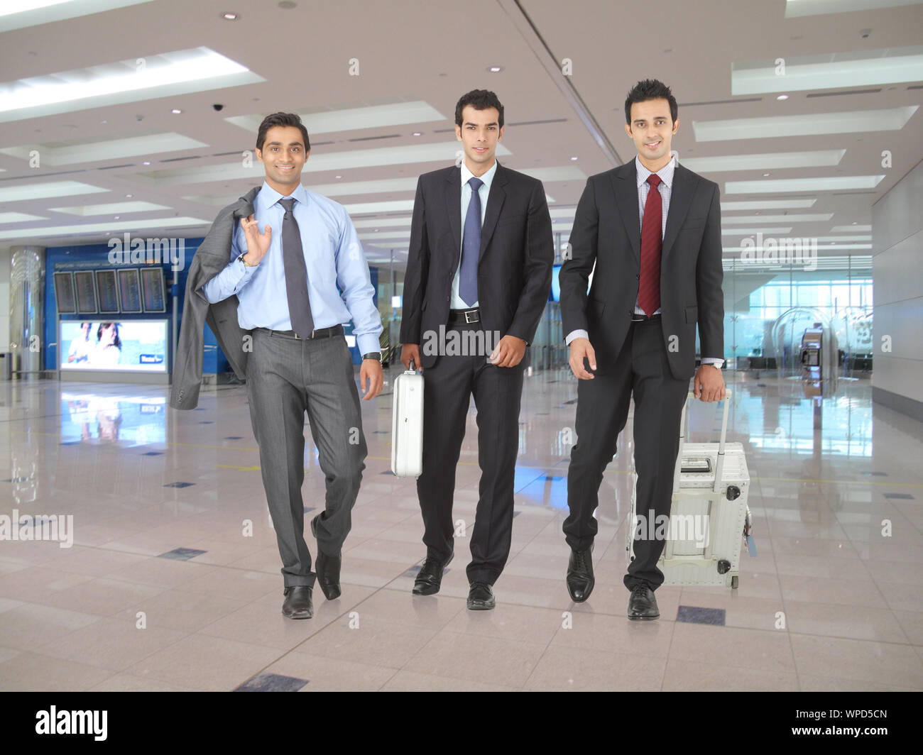 Three business executives walking hi-res stock photography and images - Alamy