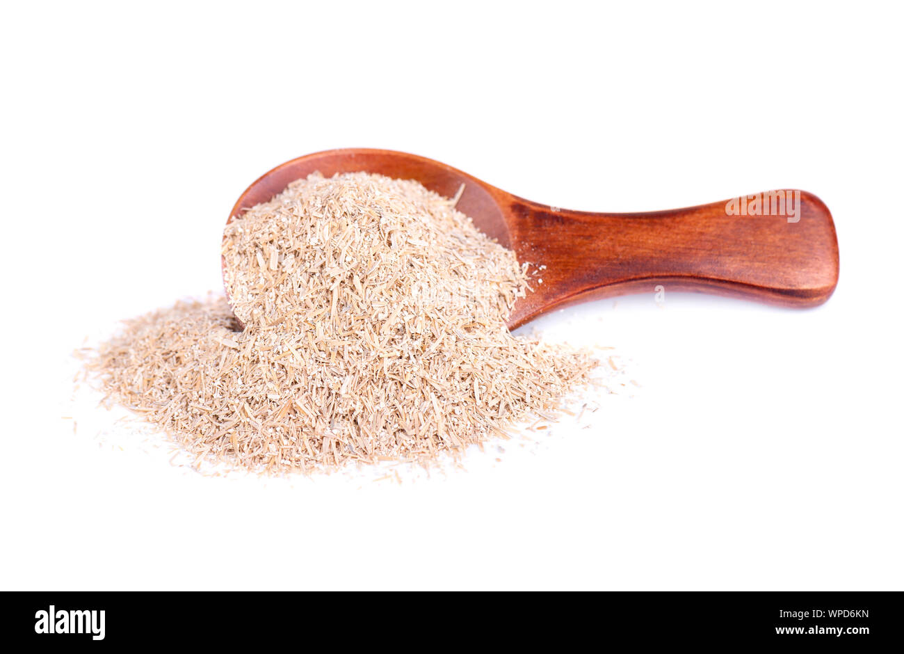 Wheat bran in a small wooden spoon, isolated on white. Wheat germ, the ...