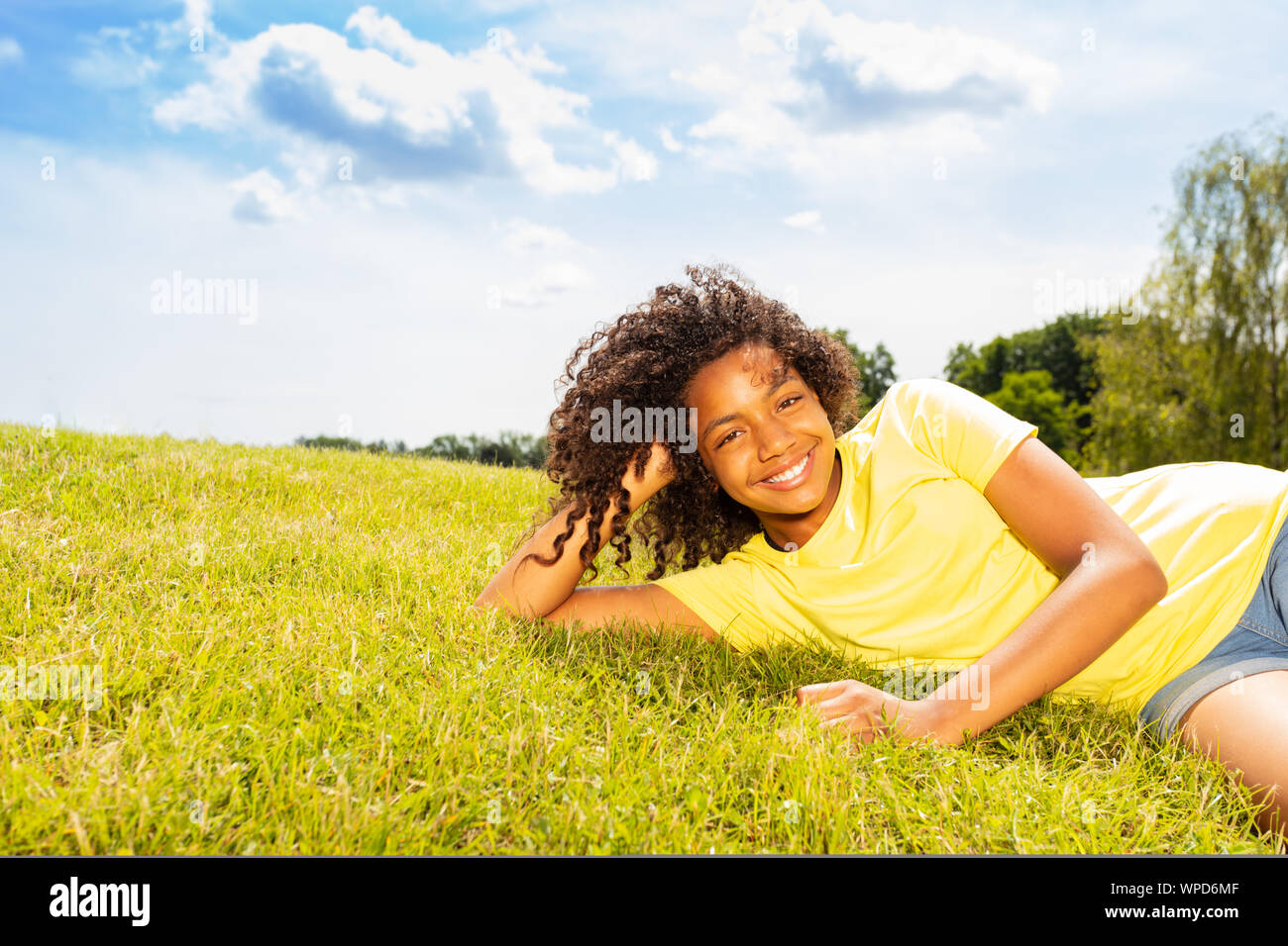 Girl Laying In Grass