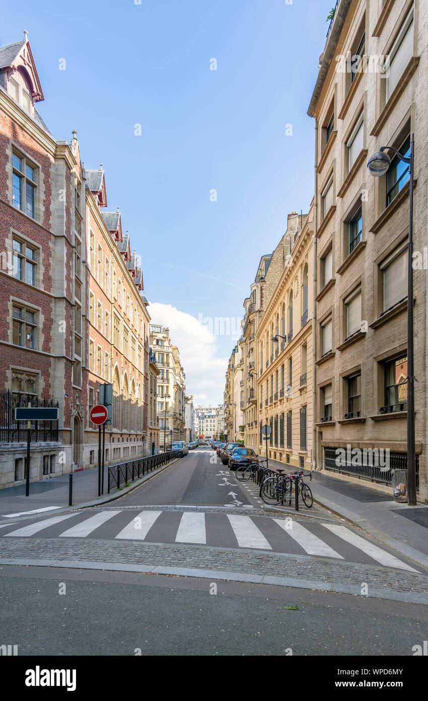 Old Paris street with high-rise residential brick buildings of ...