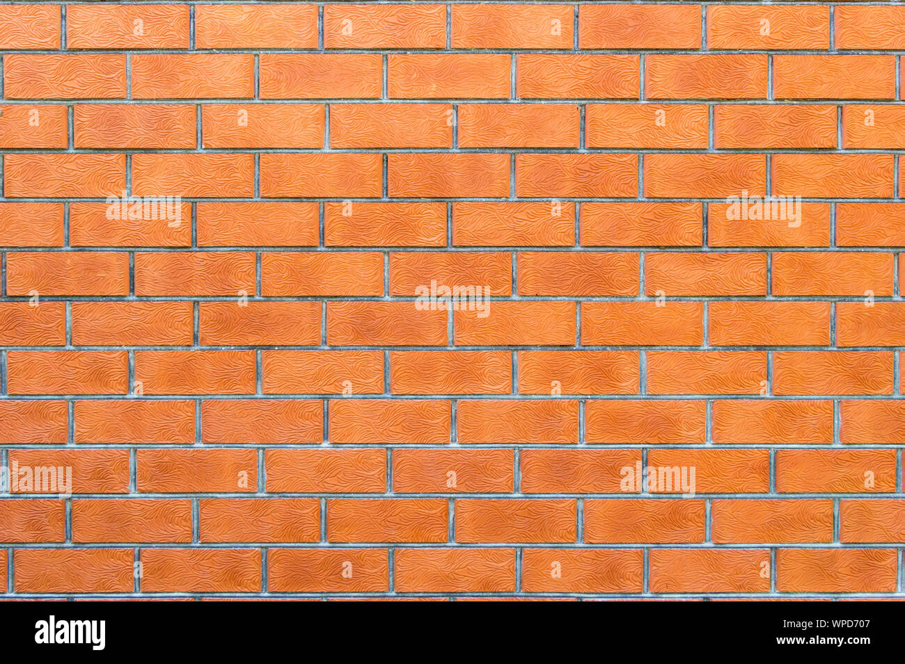Red bricks wall background. Texture from brick horizontal masonry. Decorative facade of the ...