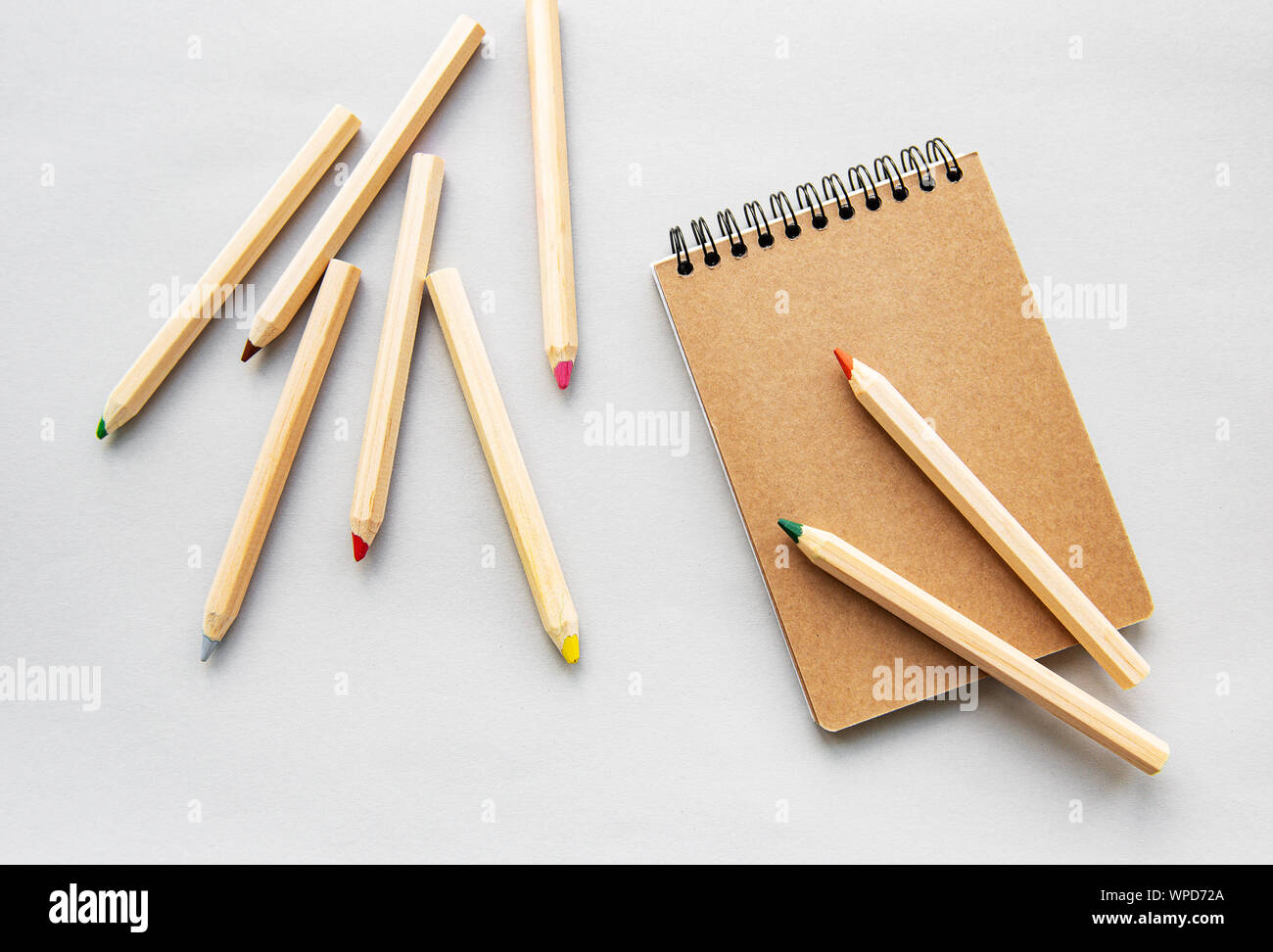 Recycle notebook and wooden pencils on white background Stock Photo - Alamy