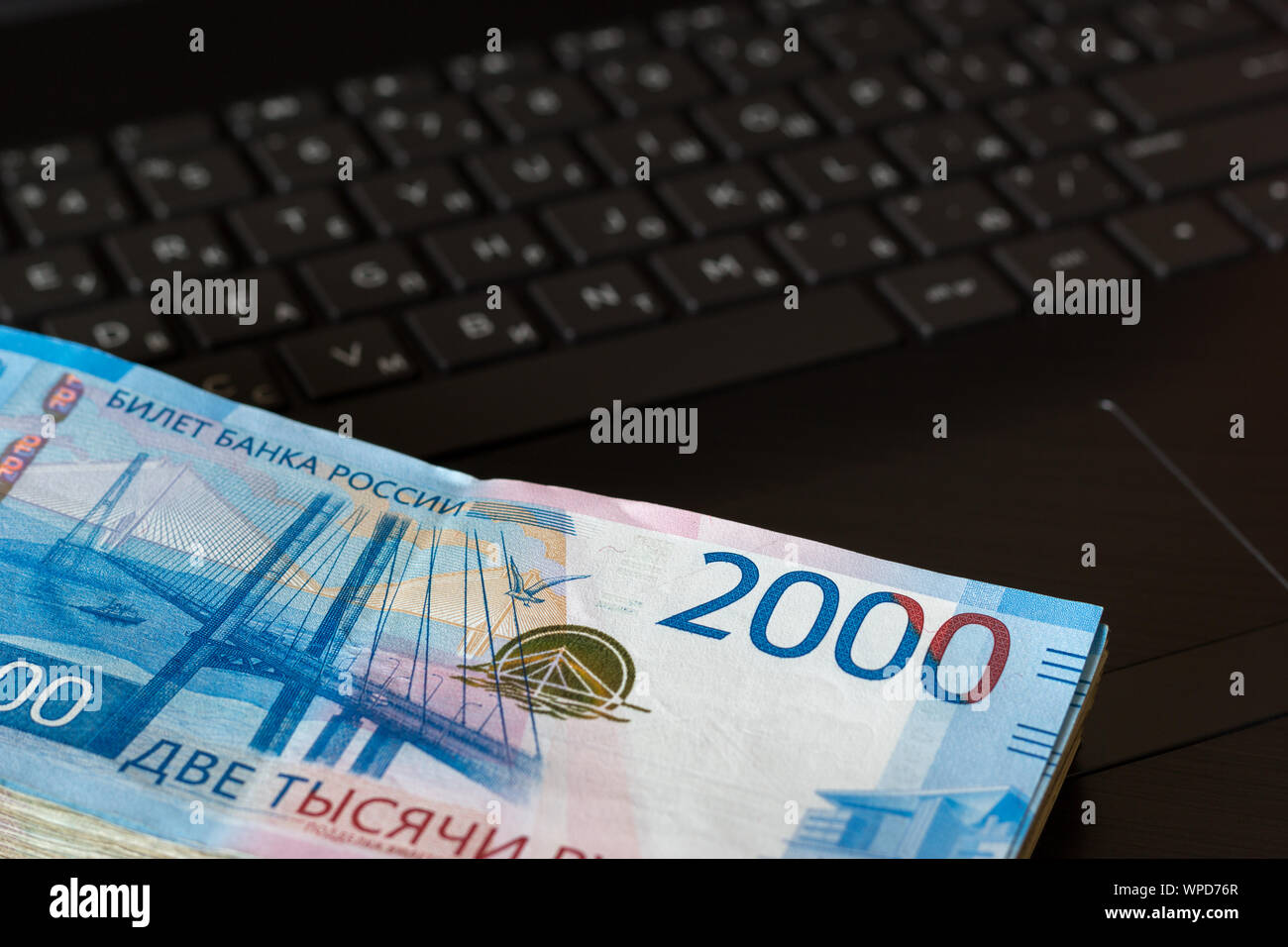 A pack of Russian rubles with a face value of 2000 rubles lies on the ...