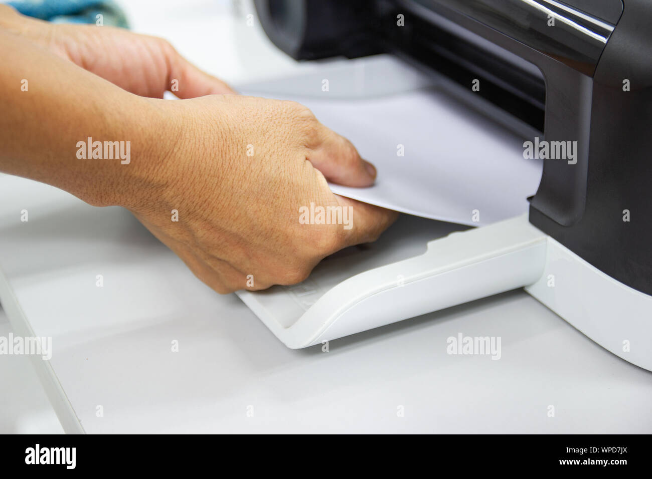 hand man lay down the paper from printer in the office, Business ...