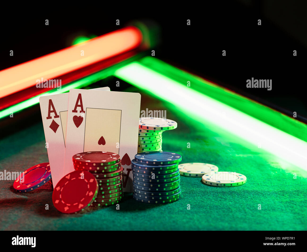 Close-up photo of two aces hearts and diamonds standing leaning on ...