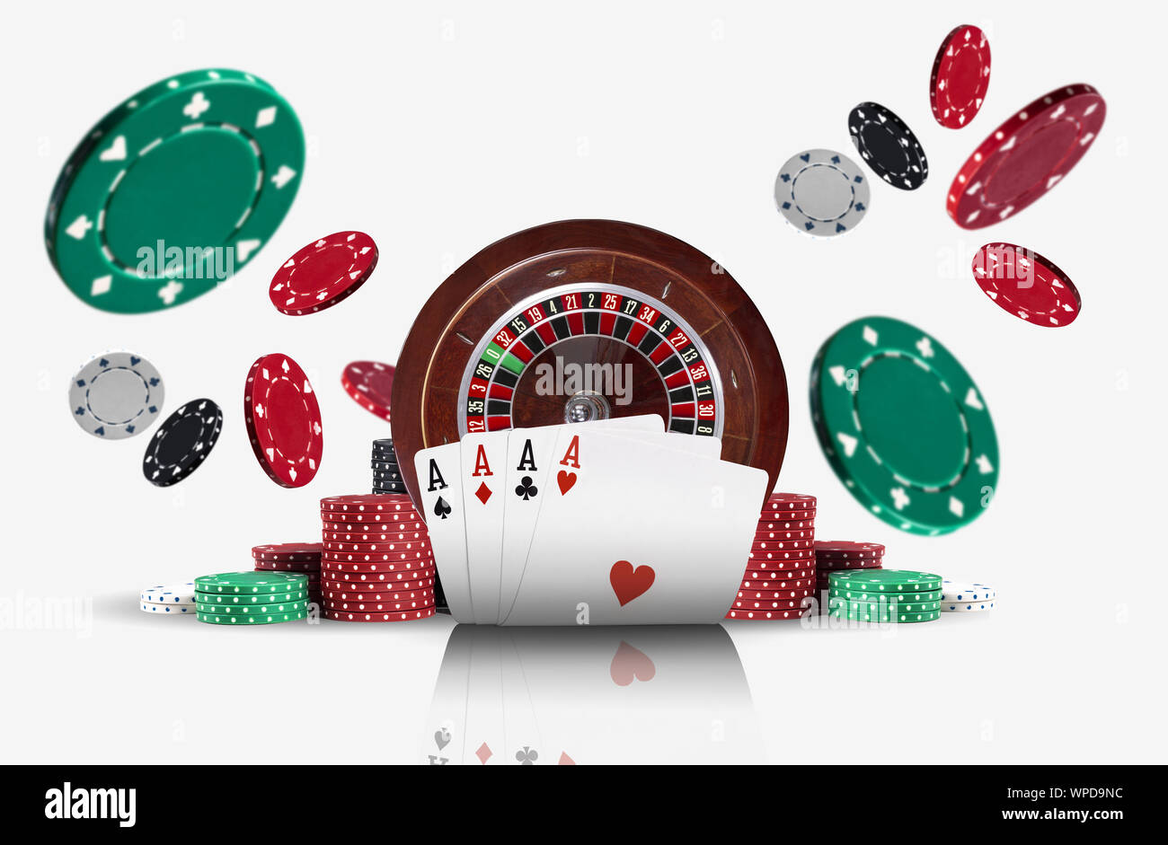 Close-up photo of four aces standing ahead of a brown roulette and ...