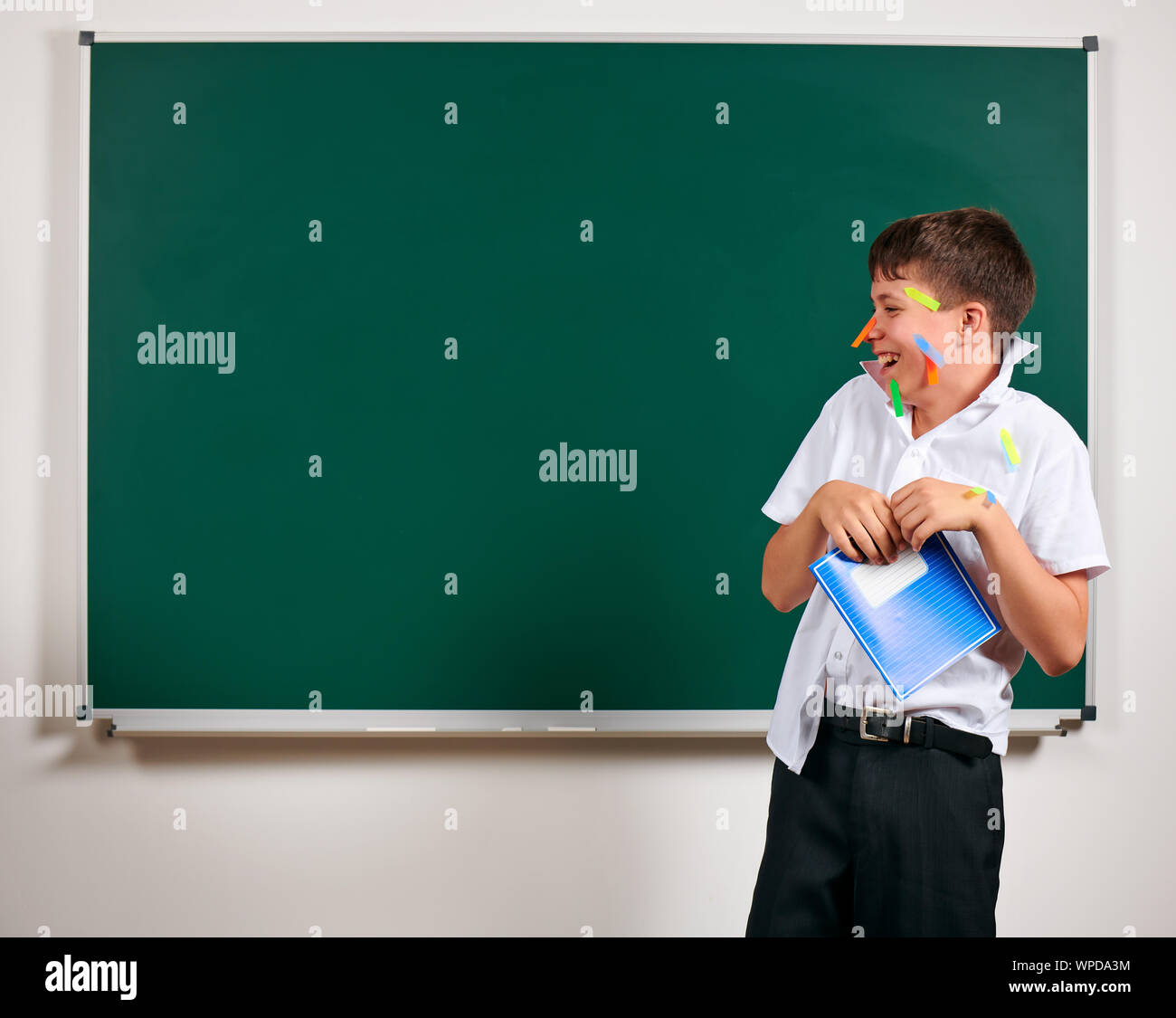 Portrait of funny pupil. School boy very emotional, having fun and very ...