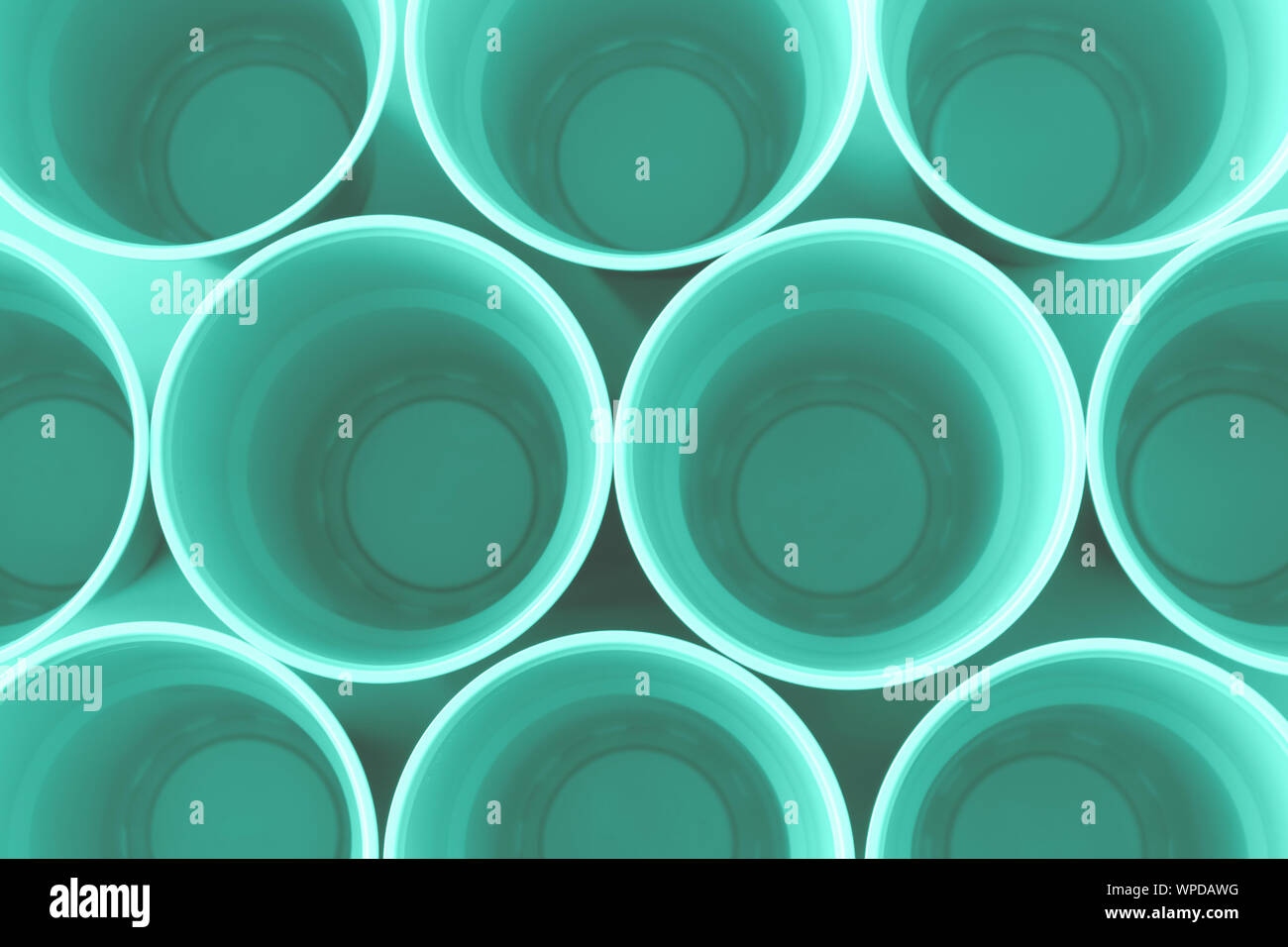 Disposable plastic neon mint cups background. Top view of single-use ...