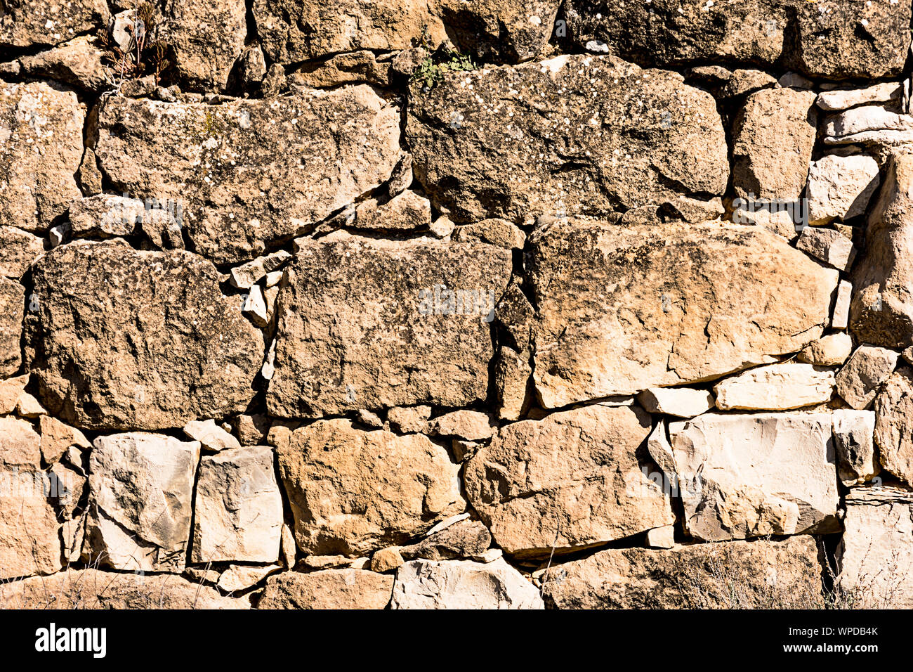 Ancient stone wall in a rural zone. Old stones texture. Outdoors ...
