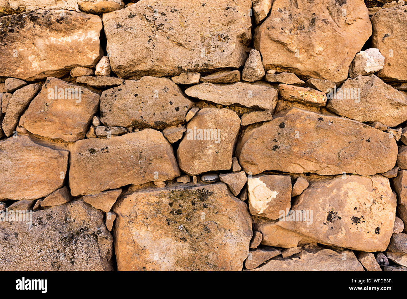 Ancient stone wall in a rural zone. Old stones texture. Outdoors ...
