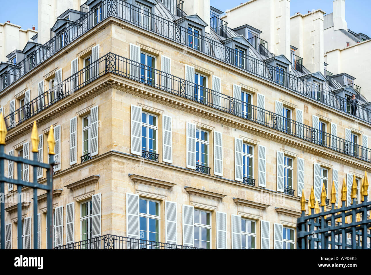 Residential houses with attic lofts, wooden identical shutters ...