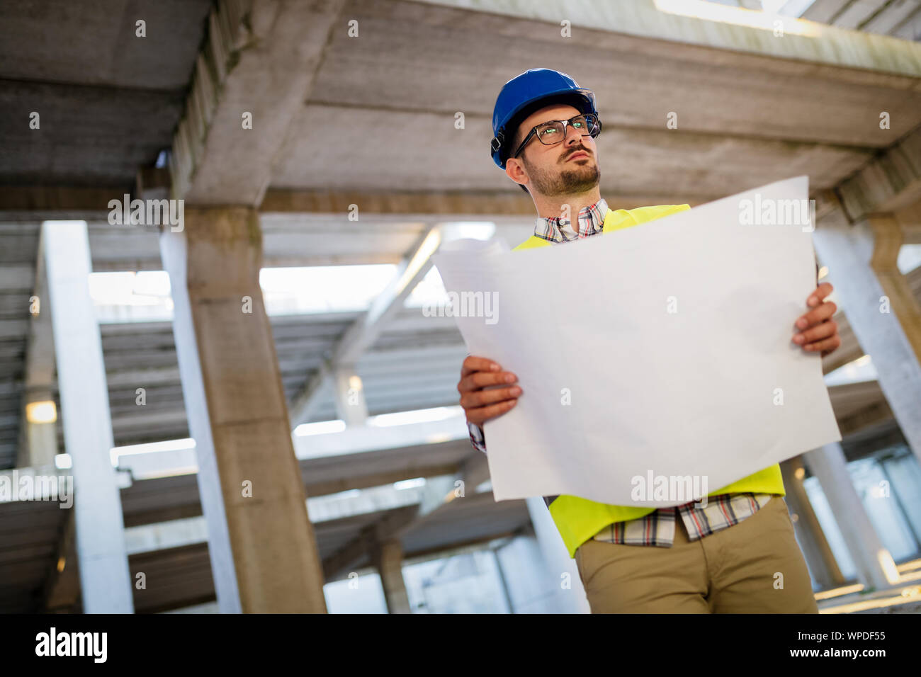 Engineers working on a building site Stock Photo - Alamy