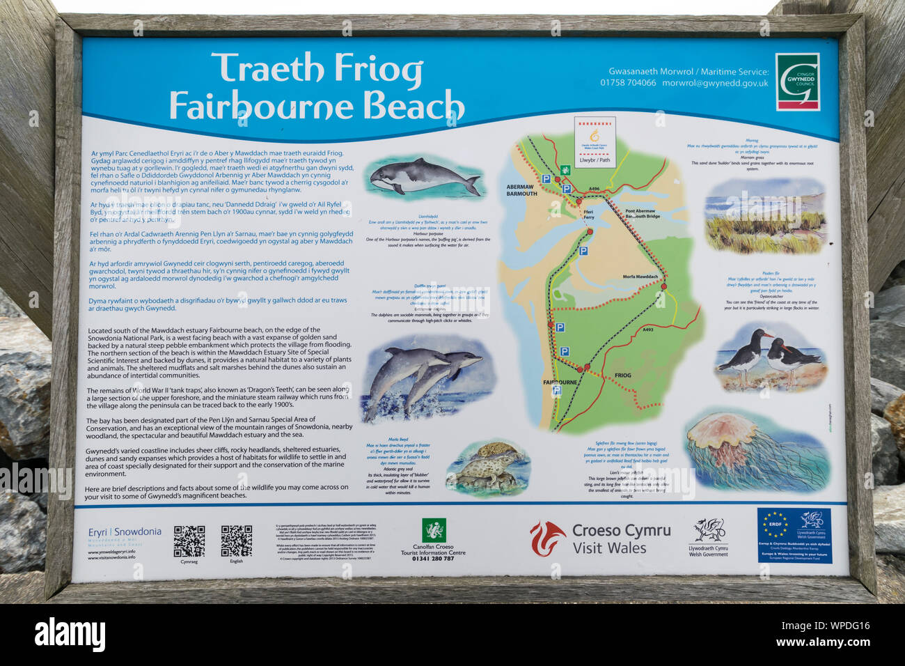 Tourist information board on Fairbourne beach near Barmouth in Gwynedd ...