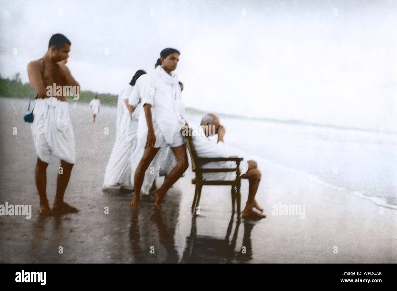 Mahatma Gandhi sitting on chair and Devdas Gandhi on Juhu Beach, Bombay ...