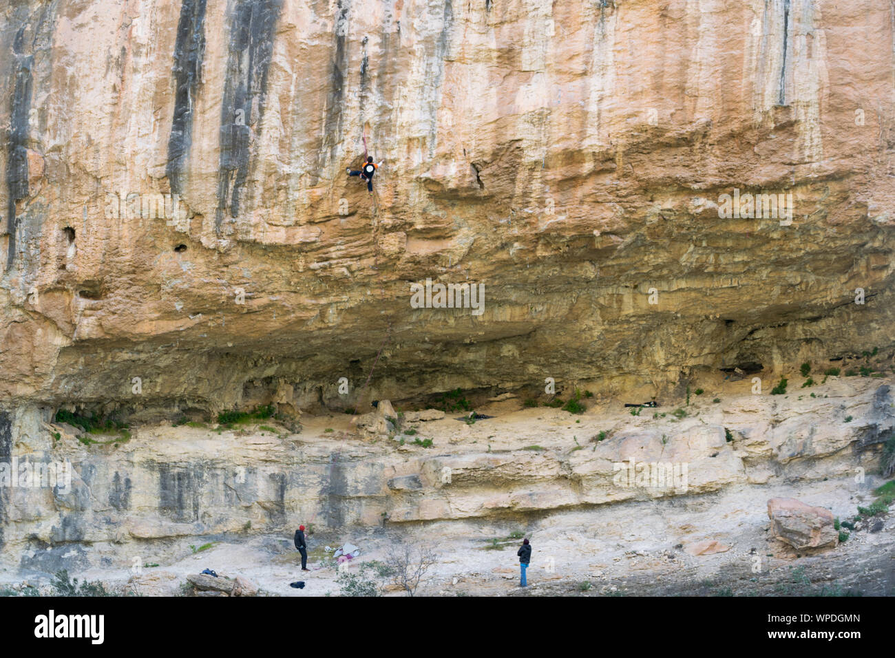 Climber climbing a wall in the climbing area of Chulilla, Valencia ...