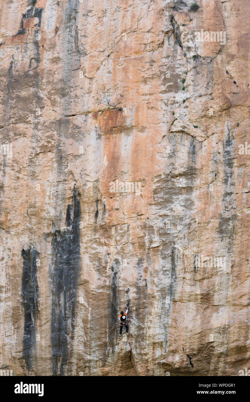 Climber climbing a large wall of the canyon of Chulilla, Valencia Stock ...