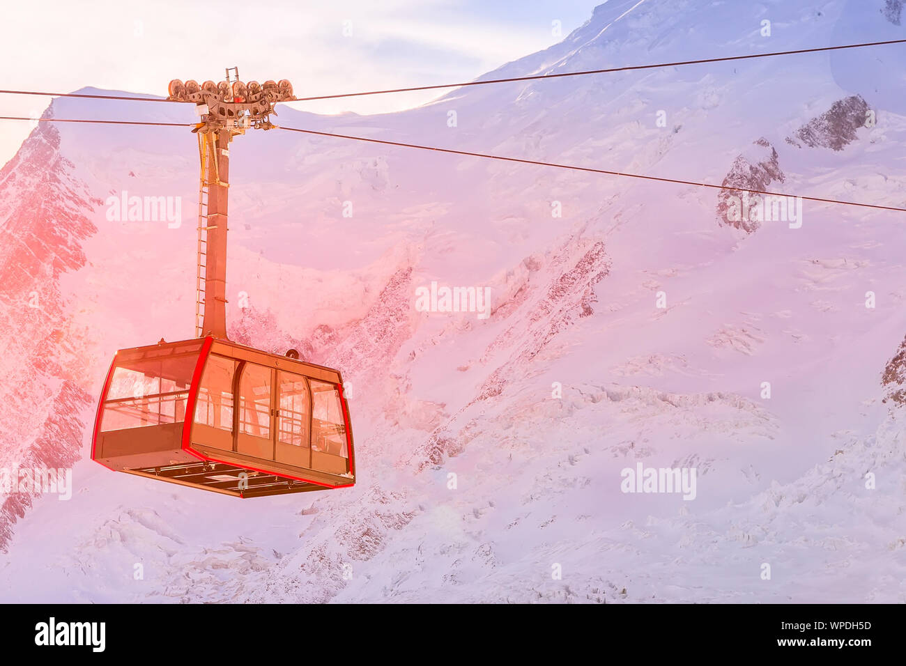Cable car and pink sunset snow mountains panorama of French Alps near ...