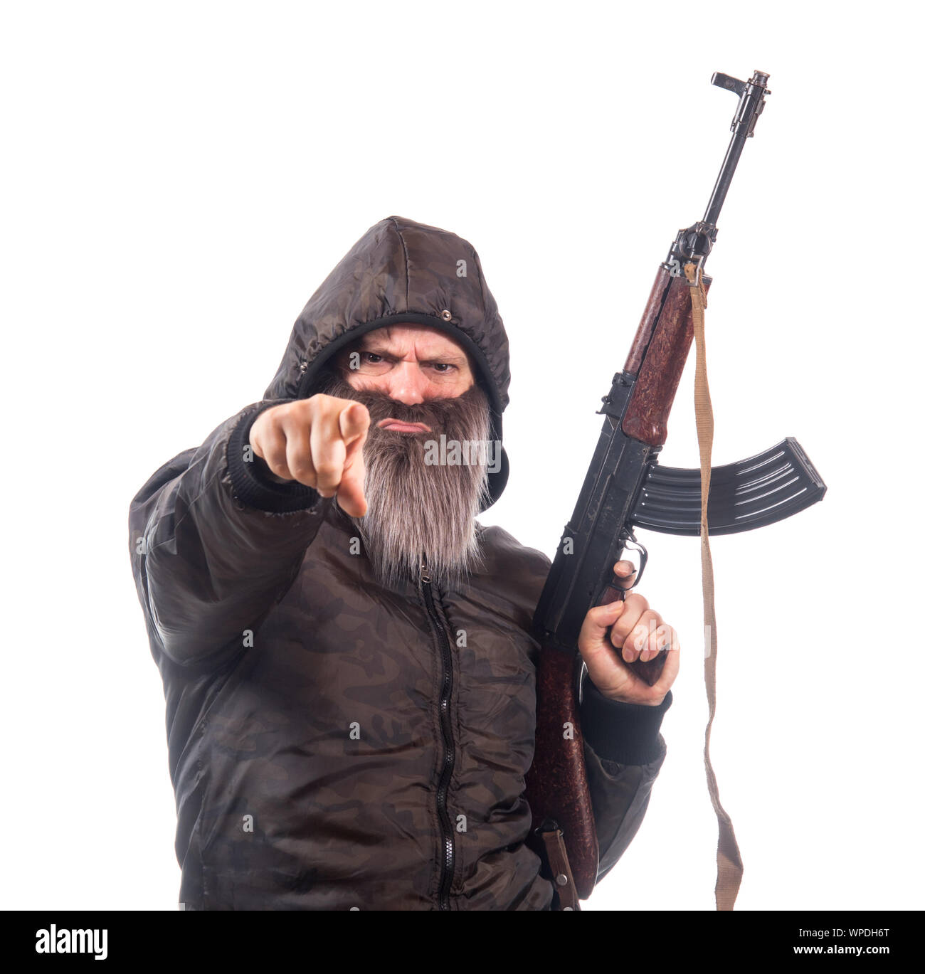 The bearded man armed with kalashnikov isolated on a white background ...