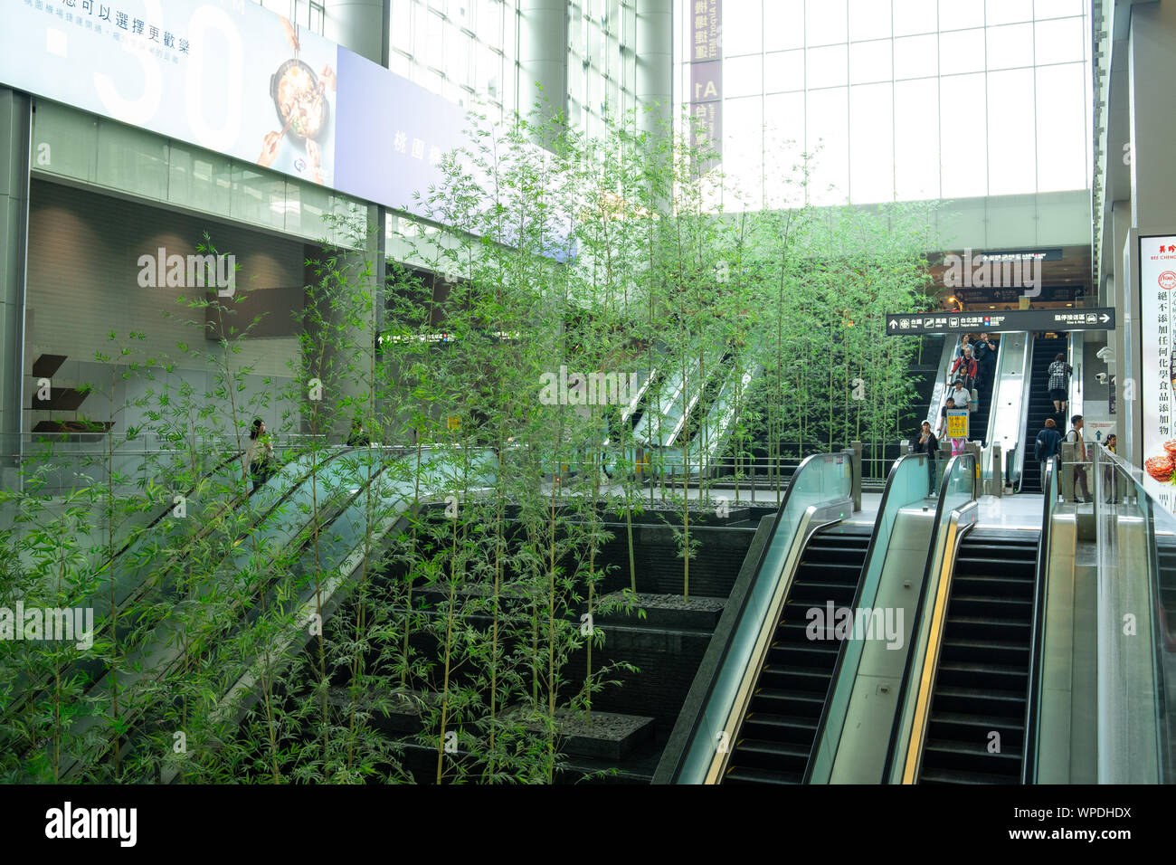 Taipei, Taiwan: Fake bamboo forest next to escalators in the Taipei Airport MRT Station with a ...