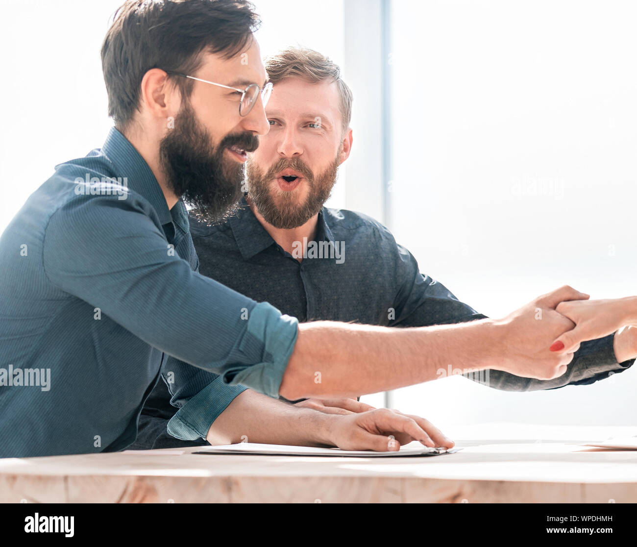 employer shaking hands with a new employee during the interview Stock ...