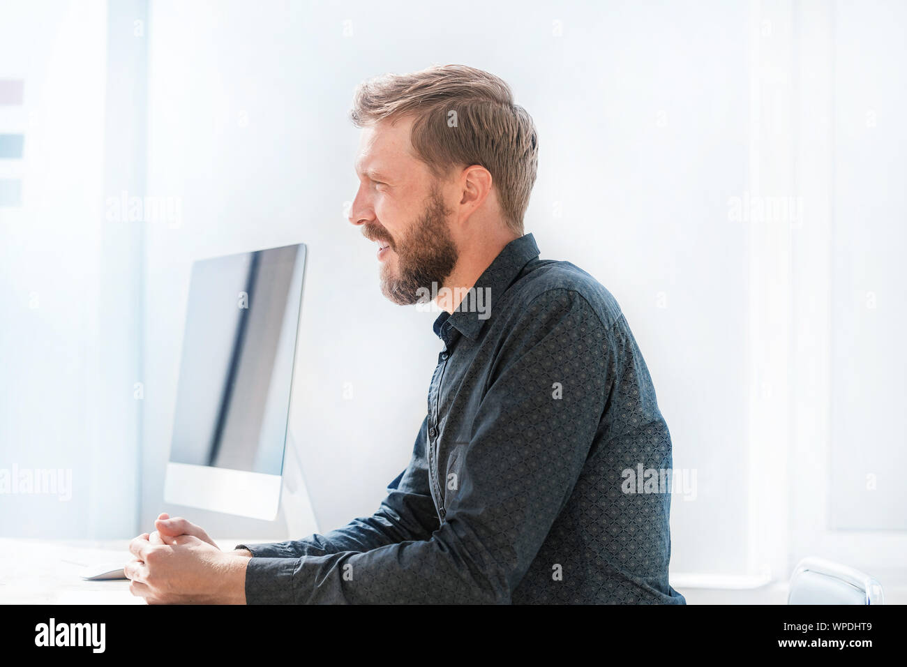 business man sitting at the office Desk Stock Photo - Alamy