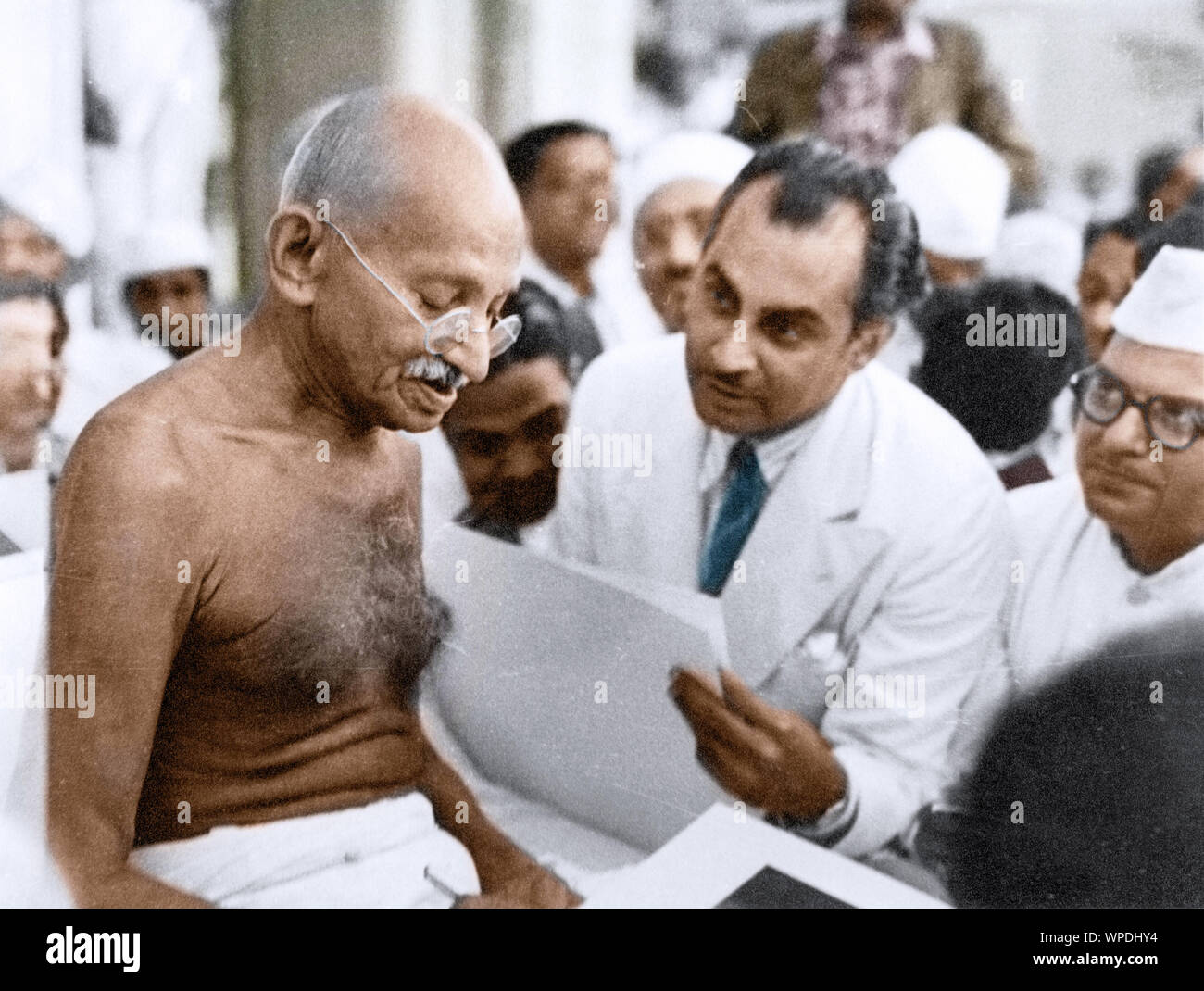 Photographer DRD Wadia showing photographs to Mahatma Gandhi, Bombay ...